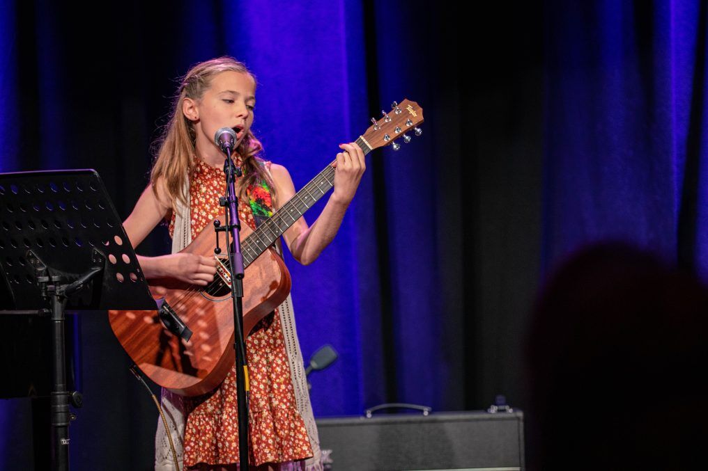 kid playing instrument